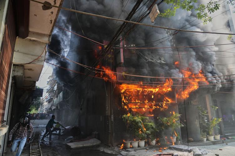 Fire sweeps through a New Delhi building, killing at least 21 people ...