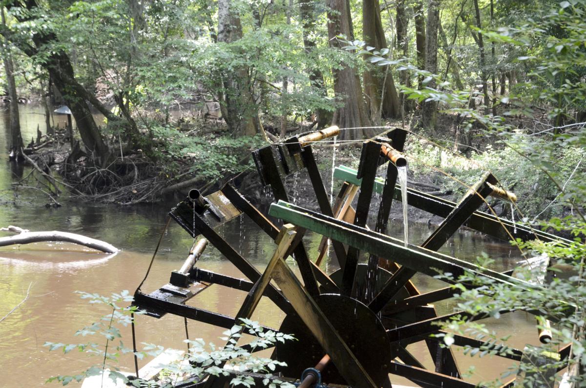 Continuous cycle of tranquility: Chinese waterwheel provides peaceful ...