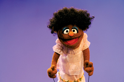 'I LOVE MY HAIR': Curly-haired Muppet is role model for little girls
