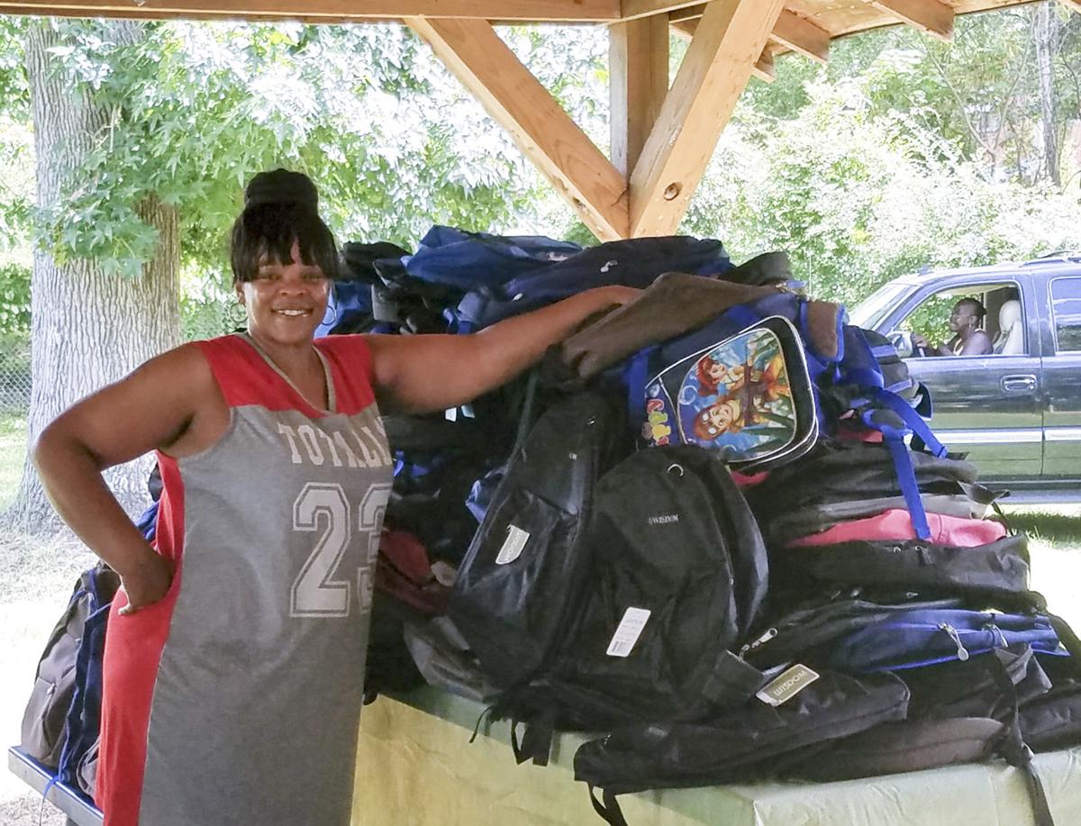 Group gives students 200 free book bags packed with supplies at Back to ...