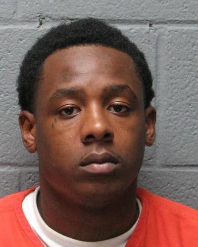 Son arrested, father sought in fatal shooting at abandoned house