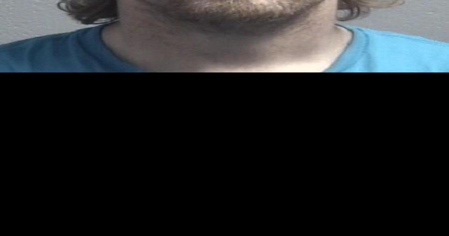 Vance man faces new charge; suspect accused of pointing rifle at vehicle