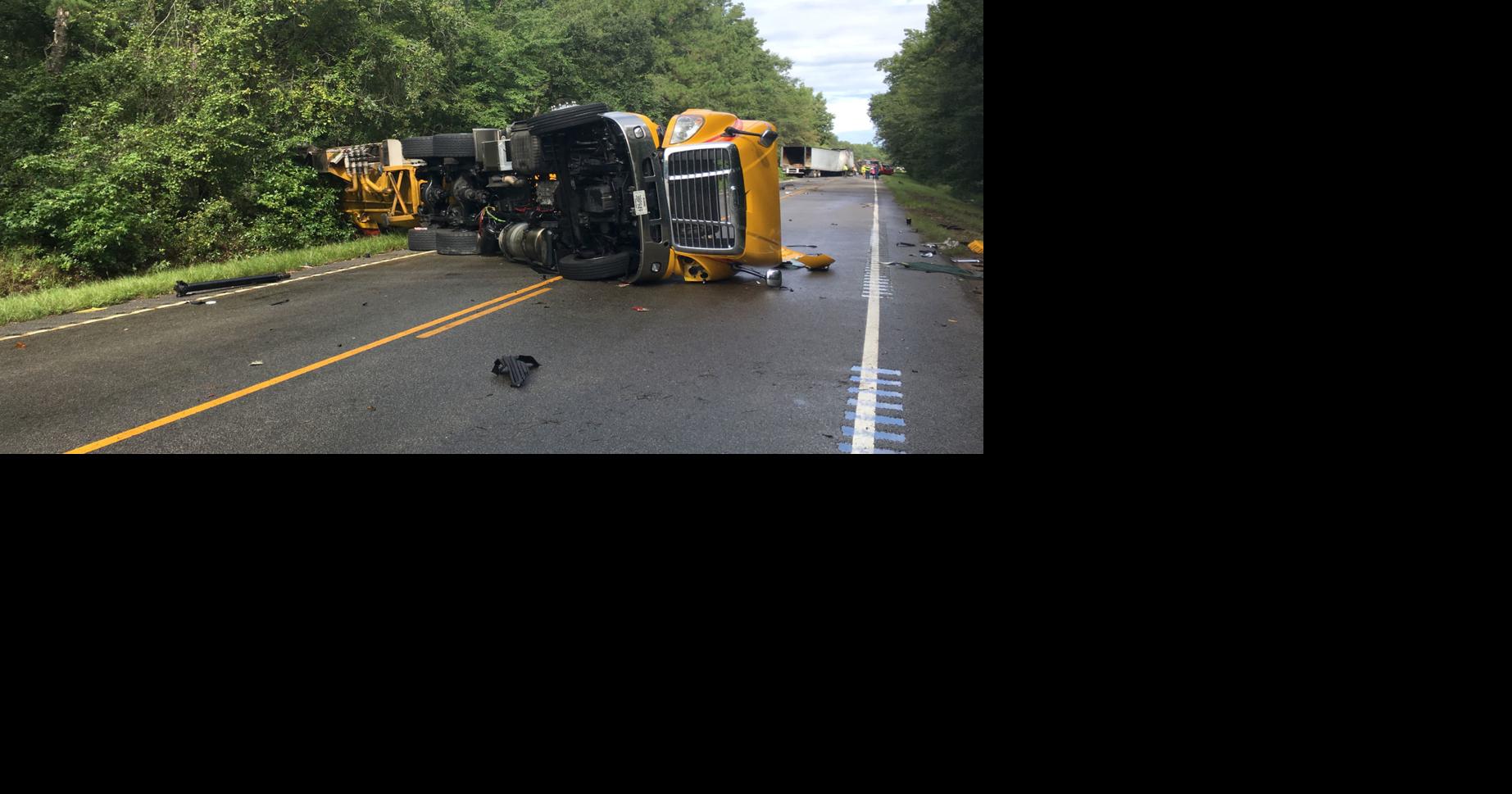 Tractor-trailers crash; 1 catches on fire; 3 people hurt