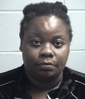 Woman charged in shooting