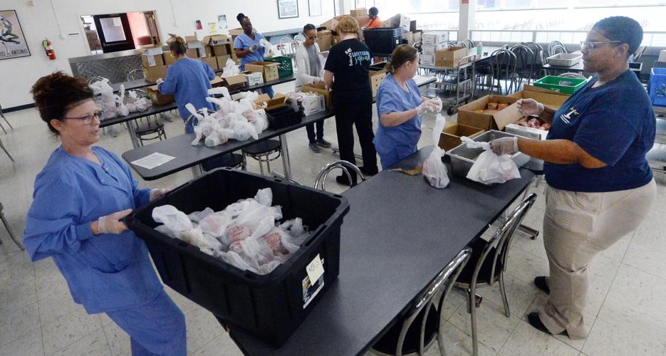PHOTOS: ABSS grab and go lunches prepared for delivery to students ...