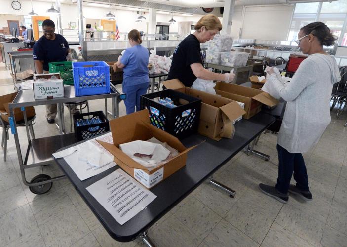 PHOTOS: ABSS grab and go lunches prepared for delivery to students ...