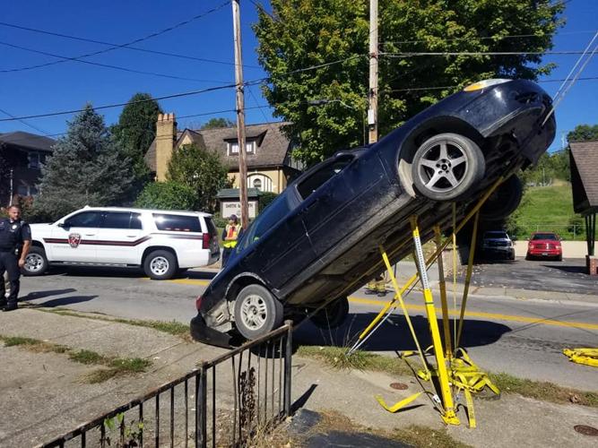 Car gets stuck at an incline after running up guy-wire | News ...
