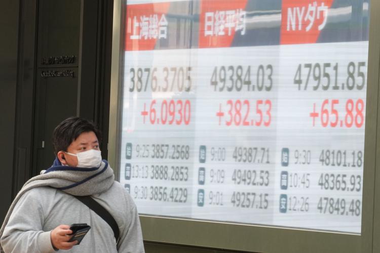 Asian shares advance after Japan raises its key interest rate to its ...