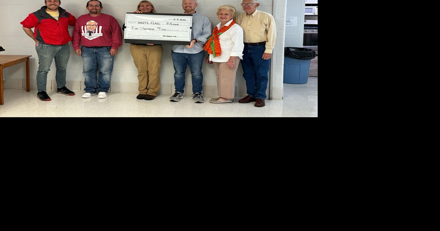 Colonel Fest Race Committee presents White Flag Ministries with check ...