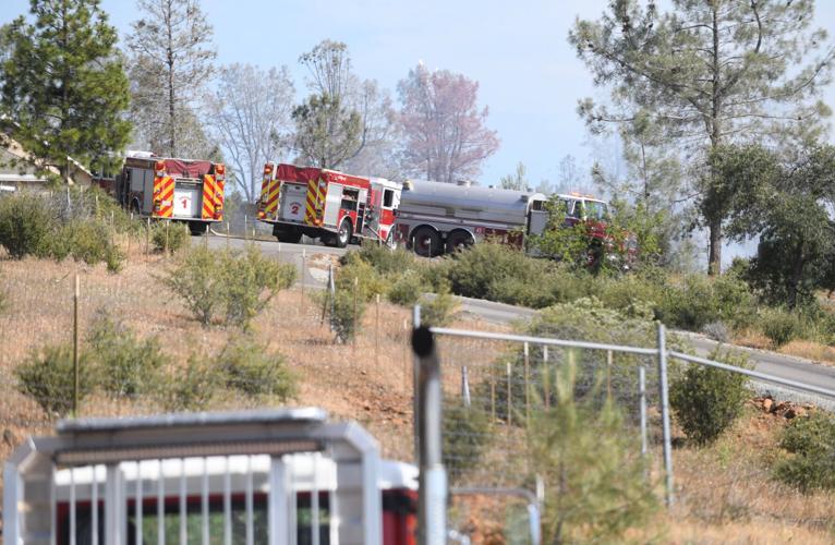 McCourtney vegetation fire threatens structures before firefighters ...
