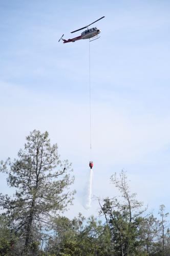 McCourtney vegetation fire threatens structures before firefighters ...