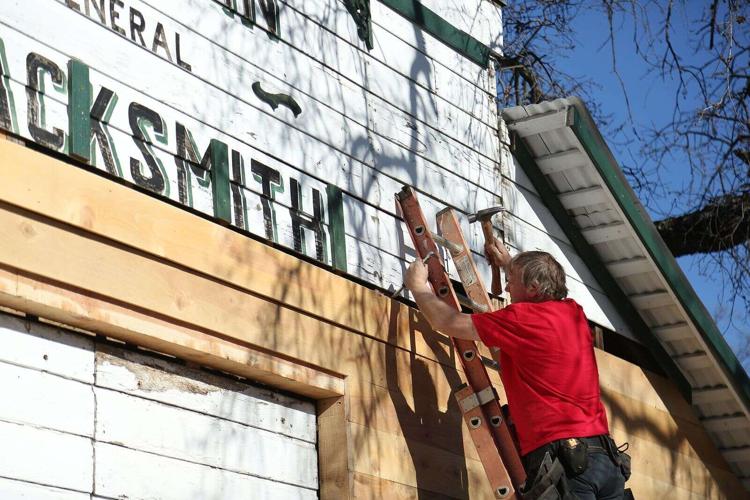 Getting a face-lift: 172-year-old blacksmith shop gets new siding in ...