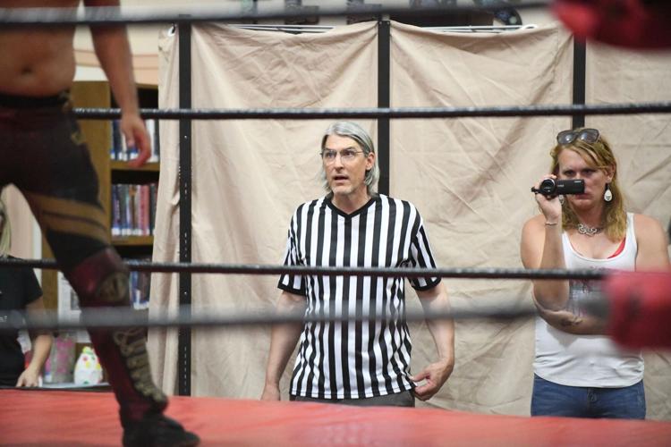 'Slam in the Stacks' wrestling packs Madelyn Helling library ...