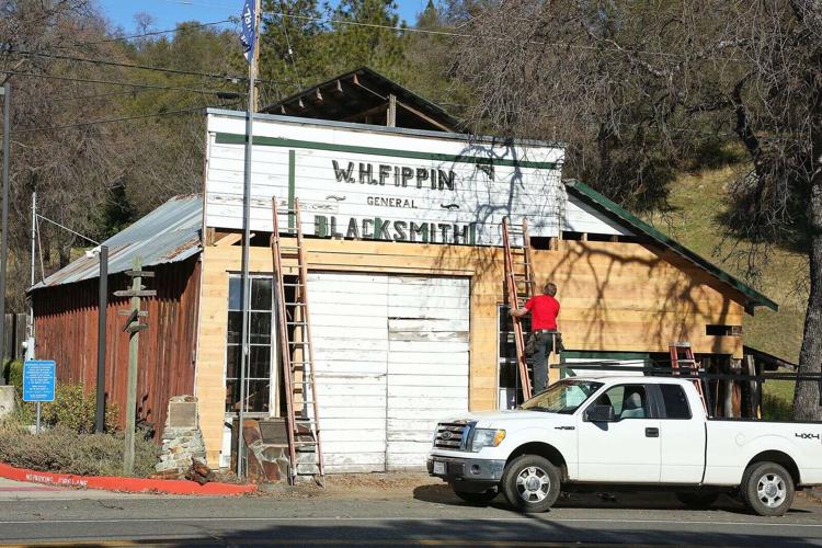 Getting a face-lift: 172-year-old blacksmith shop gets new siding in ...
