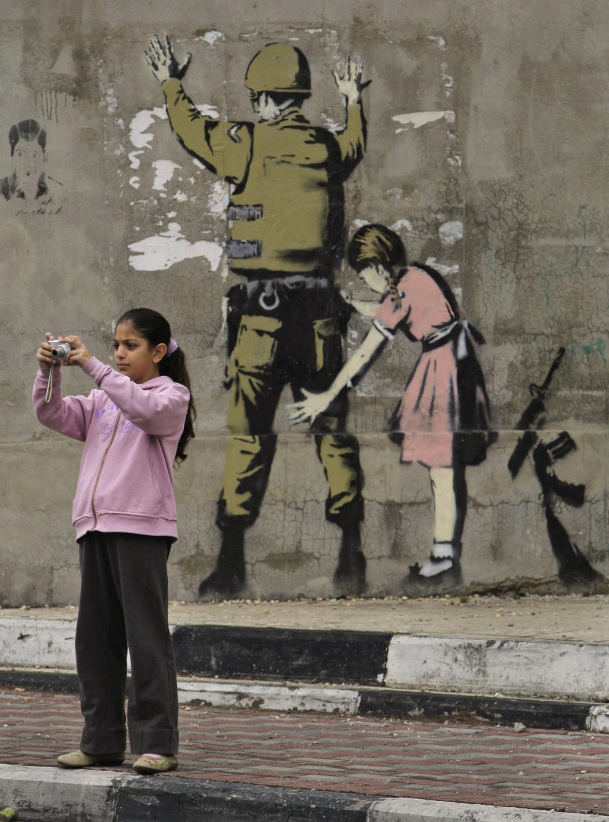 Photos: Banksy's work around the world, including new Trump murals on ...