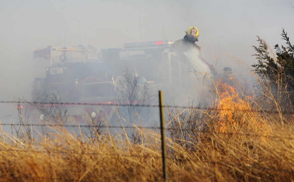 Photos: Thousands flee deadly wildfires across four states | National ...