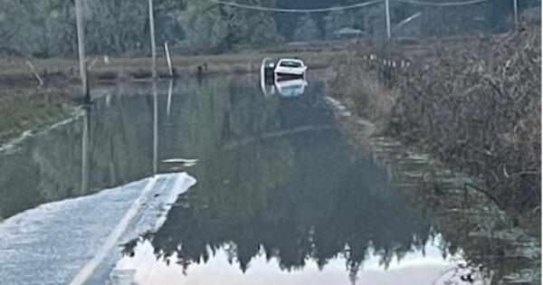 Woman disregards high water signs and becomes stranded on a flooded ...