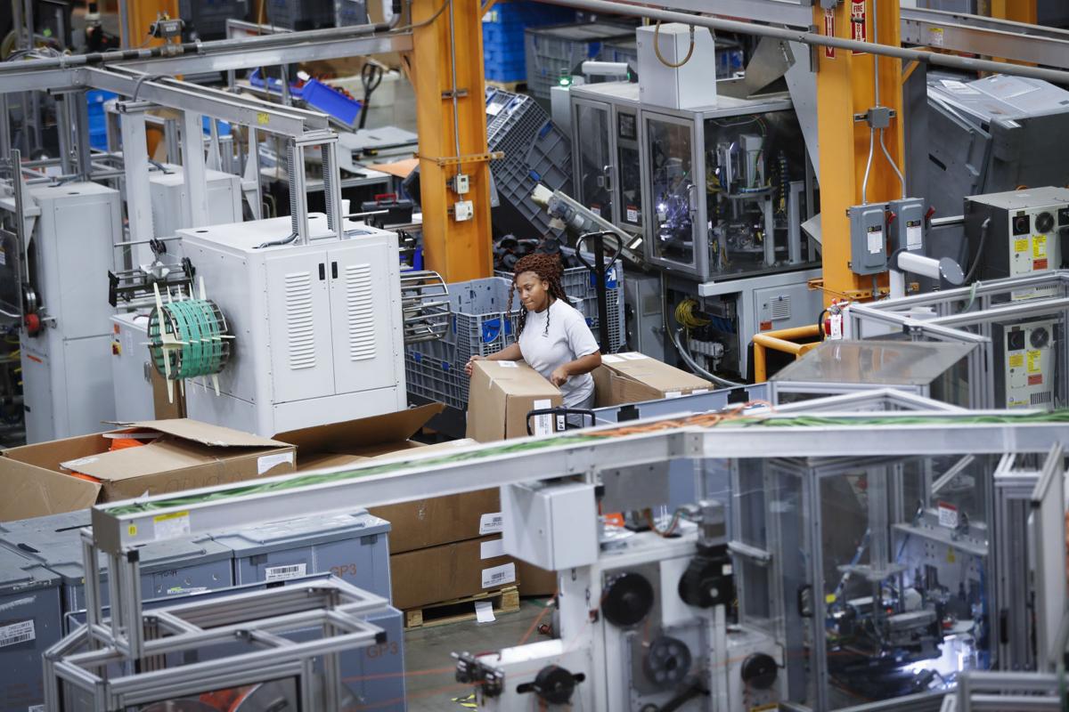 Photos: High-tech factory, low-tech workers | National News ...