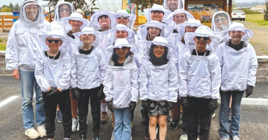 Adventist 4th and 5th grade students swarm the beehives | Community ...