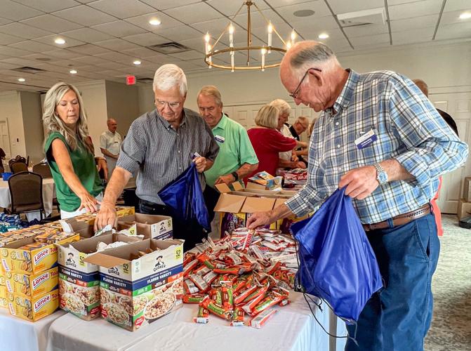 Newnan Rotary Club helps Backpack Buddies prepare for school year ...