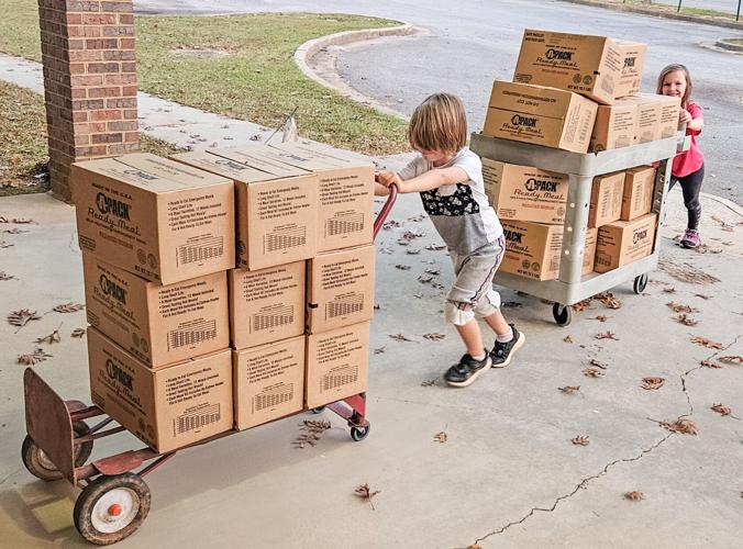 Cub Scouts, church distribute 6,000 MREs to Coweta food pantries | News ...