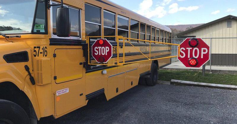 Extended stop sign arm installed on school bus eliminates passing ...