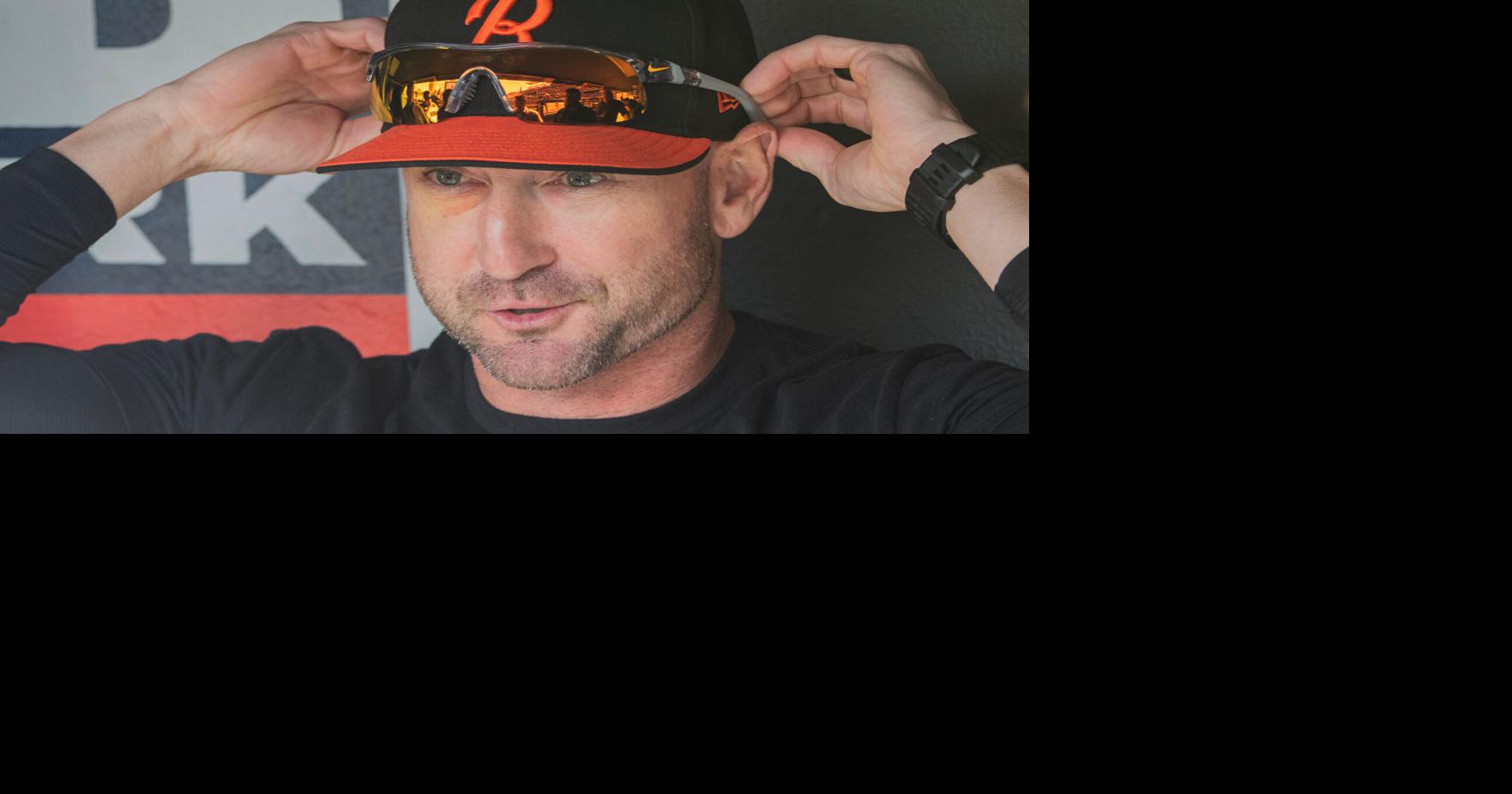 Orioles manager playfully puts on a mask in the dugout to protect ...