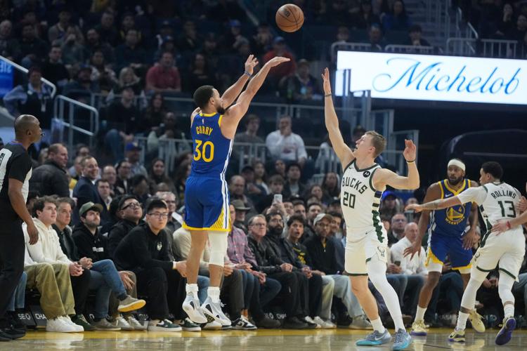 Stephen Curry, Jimmy Butler lead Warriors past Bucks, 120-113 | Pro ...