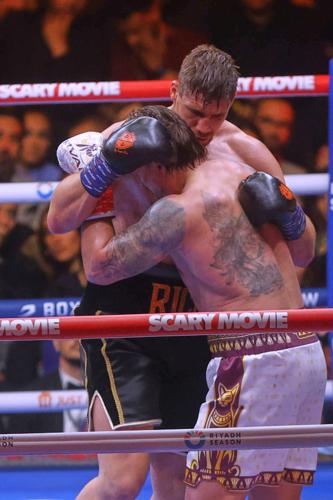 Usyk stops kickboxer Verhoeven in 11th round of heavyweight title fight ...