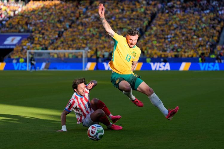 Australia clinches knockout round spot with 0-0 draw; Paraguay also ...