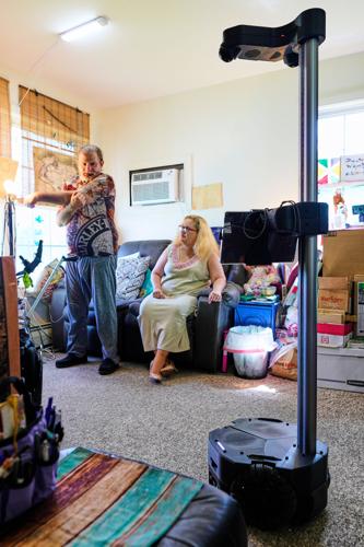 A robot is helping an ailing couple stay in their home. Are more to ...
