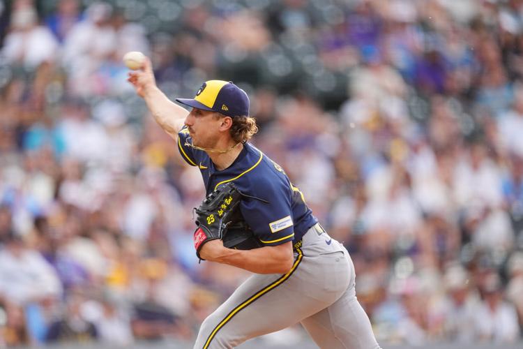 Brewers score 8 late runs, stun Rockies 9-7 in wild 10-inning victory ...