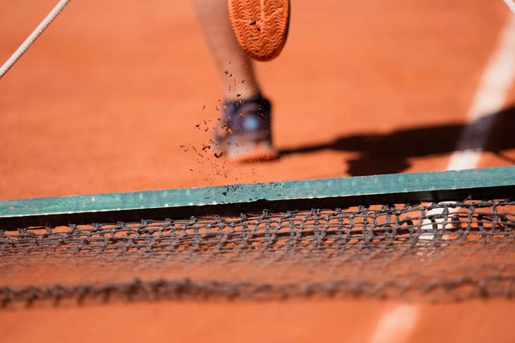 French Open groundskeepers drench the clay courts with water and salt ...