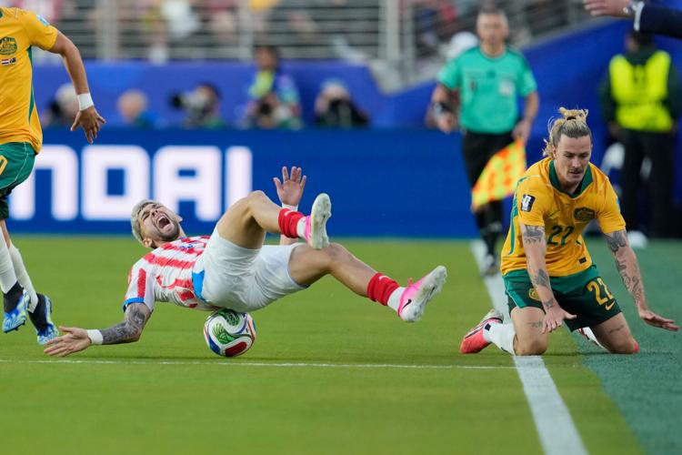 Australia clinches knockout round spot with 0-0 draw; Paraguay also ...