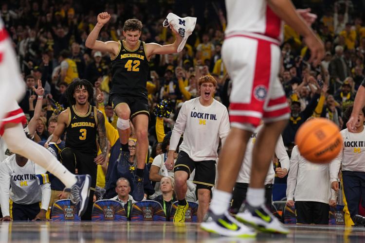 Michigan rolls to national title game with its latest double-digit ...