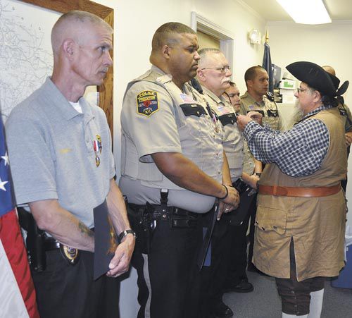 Honoring veterans... Members of police force saluted for military ...