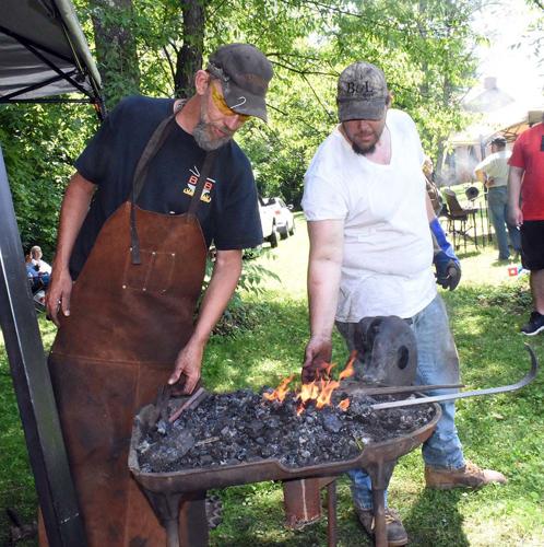 Blacksmiths craft metal tools with throwback art form at historical ...