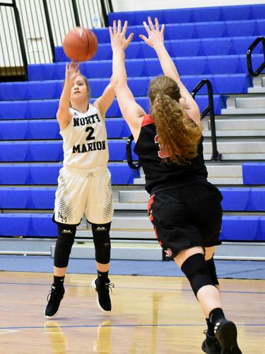 PHOTOS: Huskies’ big 2nd quarter leads them past University, 68-51 ...