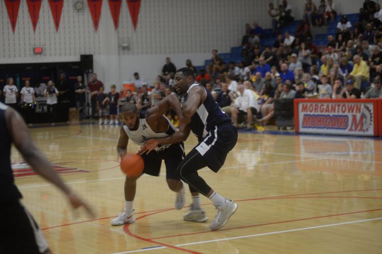 Former WVU players raise money for charity in alumni basketball game ...