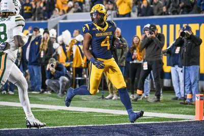 COLUMN: WVU's run-first offense to get tested Saturday at Texas Tech ...