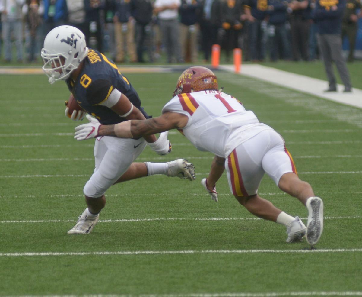 Behind physical play, WVU holds off Iowa State: PHOTOS | Sports ...