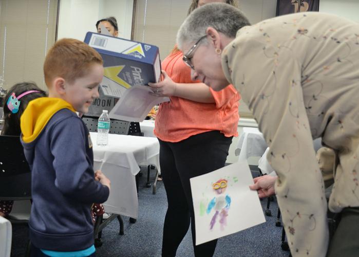 Portrait of former president Larson unveiled at celebration of college ...