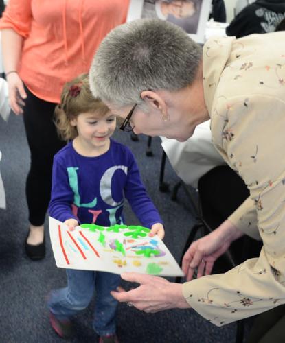 Portrait of former president Larson unveiled at celebration of college ...
