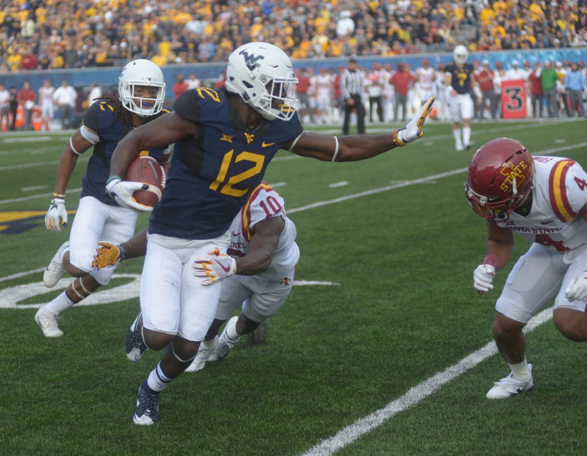 Behind physical play, WVU holds off Iowa State: PHOTOS | Sports ...