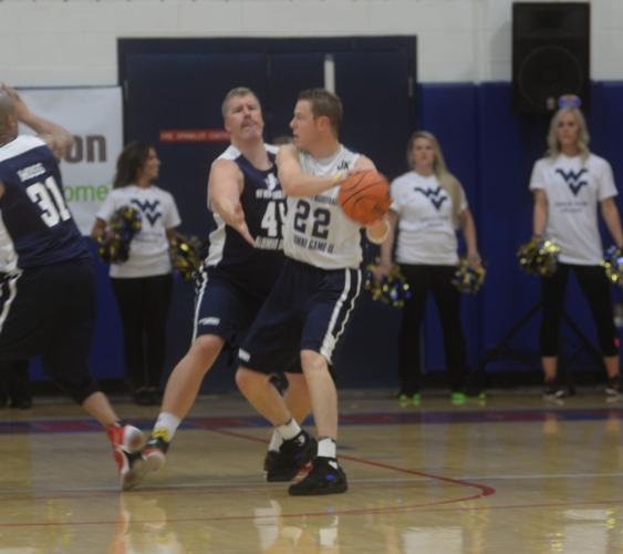 Former WVU players raise money for charity in alumni basketball game ...