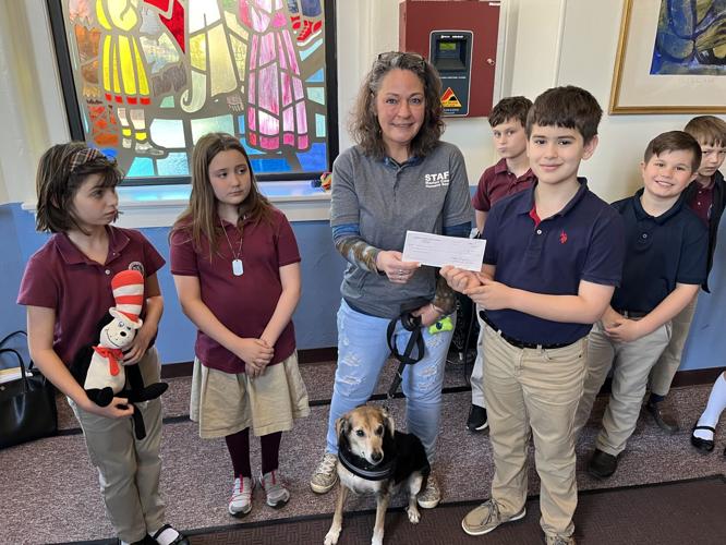 Reading event at Fairmont Catholic School raises awareness about animal ...