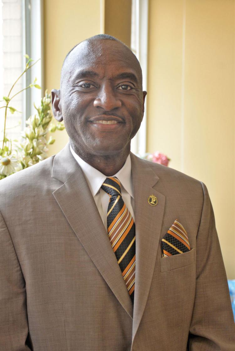 Dr. Johnny Moore, who loves family and basketball, eager to leave ...