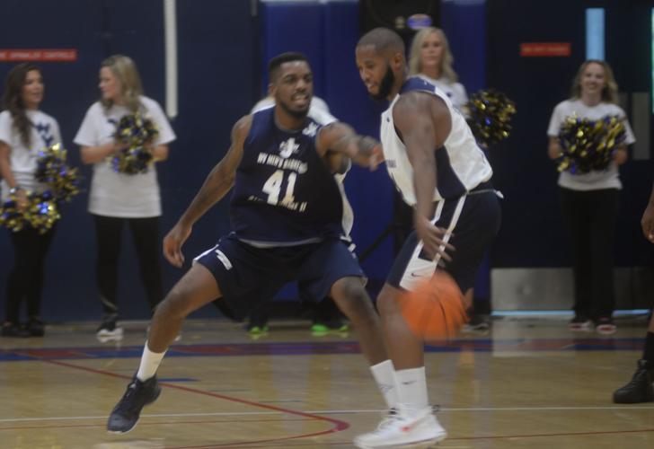 Former WVU players raise money for charity in alumni basketball game ...