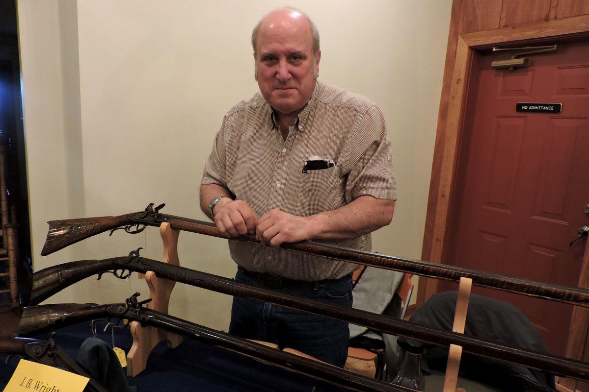 Antique firearms displayed among historical setting during weekend show ...