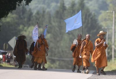Monks deliver message of world peace as they travel through area | News ...